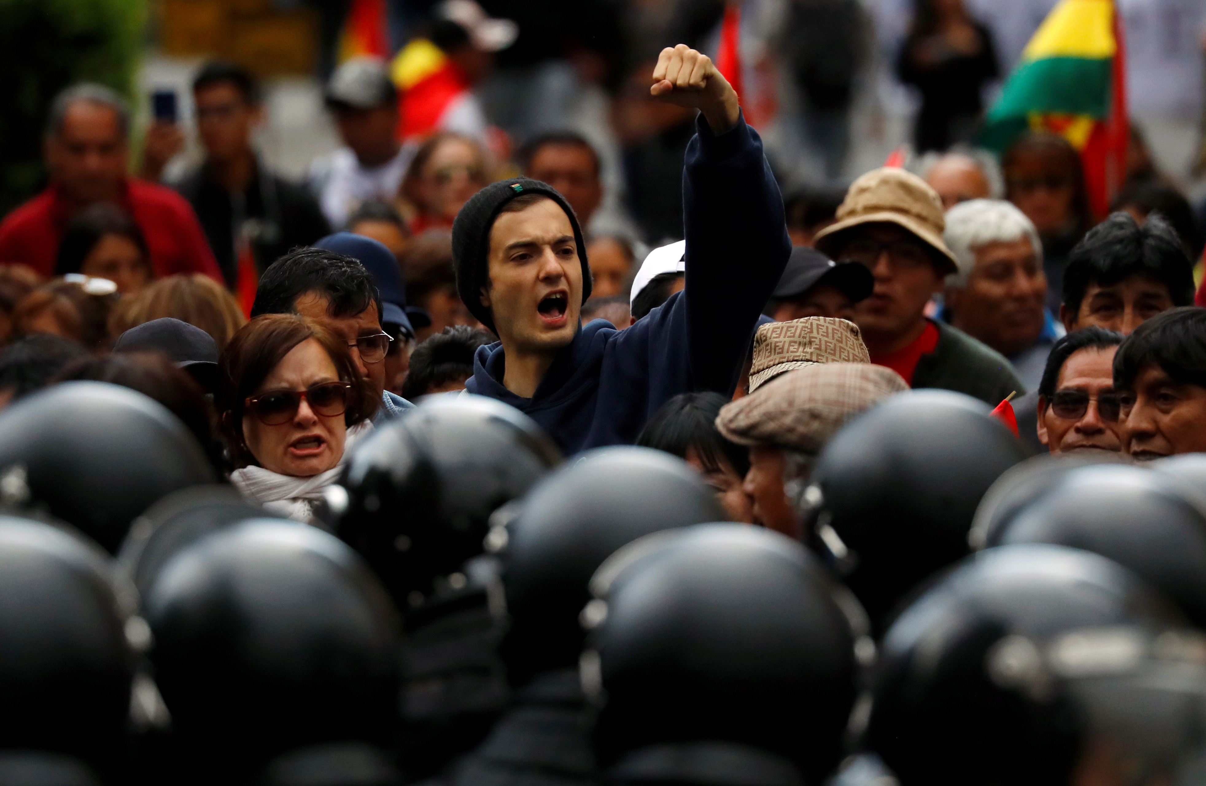Bolivians block roads in protest as Morales election win splits nation