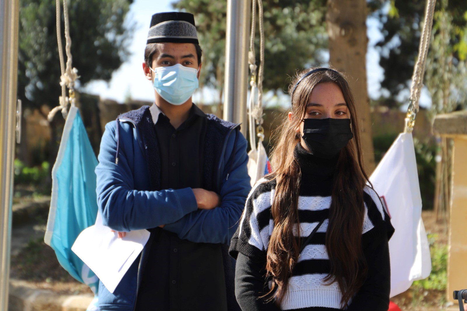 Interfaith children wave flag of unity and love - Newsbook