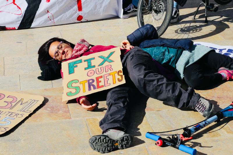 Activists stage lie-in outside Parliament to protest deadly roads