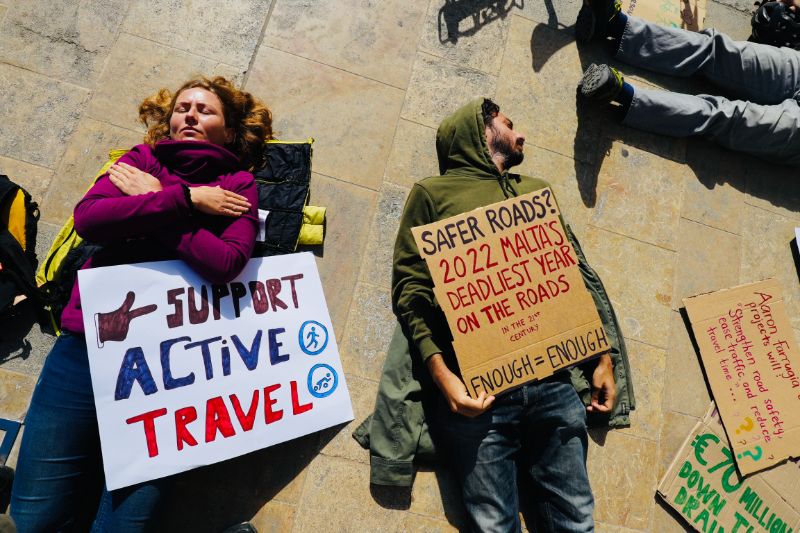 Activists stage lie-in outside Parliament to protest deadly roads