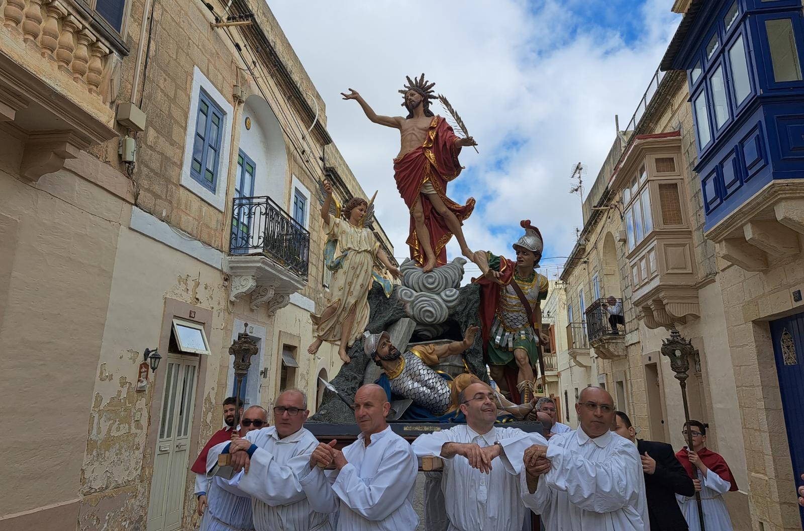 Gathered in village squares, people celebrate Easter Sunday in Malta