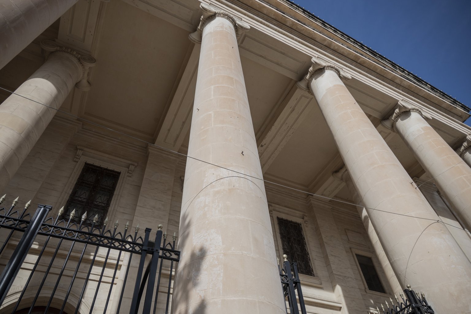 Two men charged with fraud, one remanded in custody