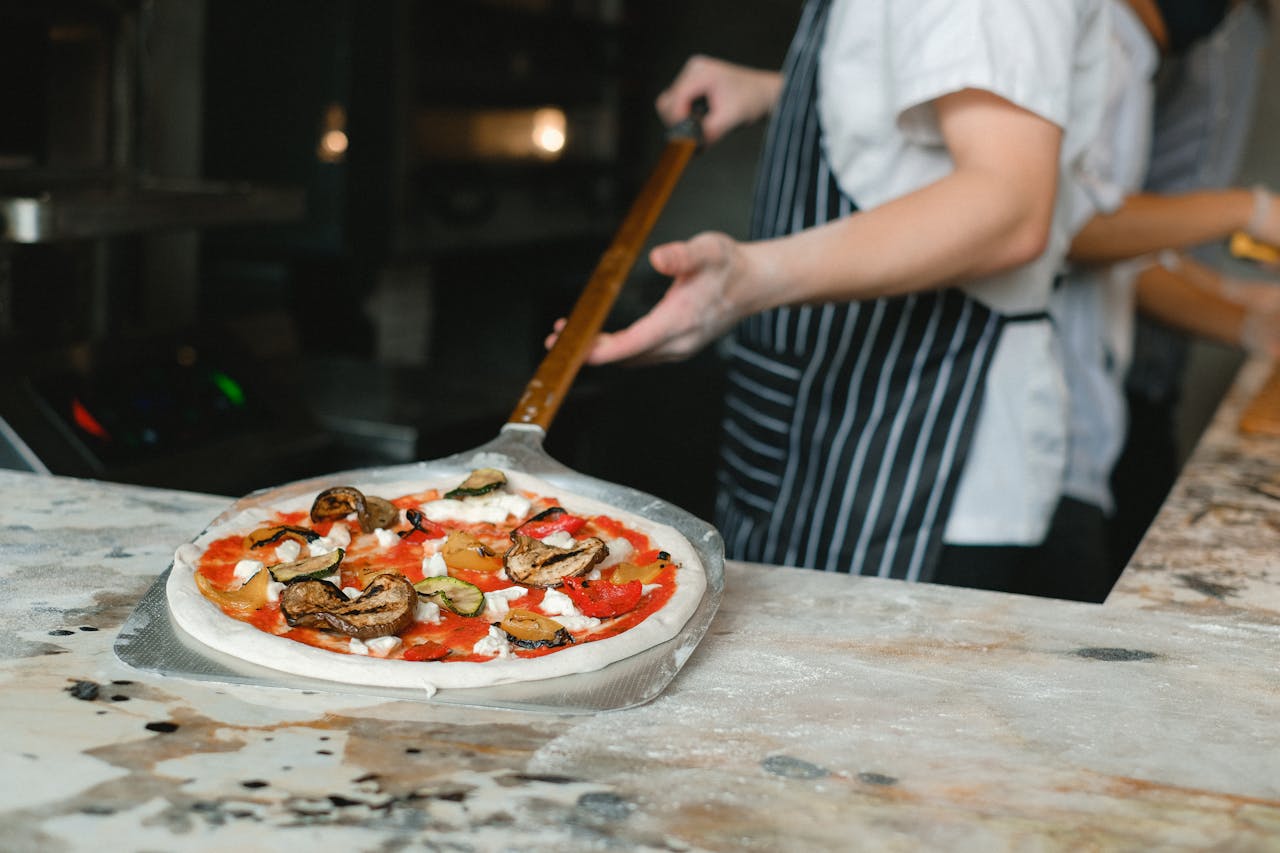 Pizza chef denies assaulting colleague in restaurant kitchen